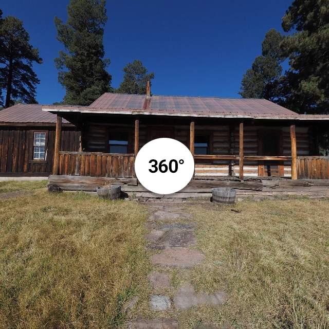 In front of Walt's iconic cabin from the Longmire Series...